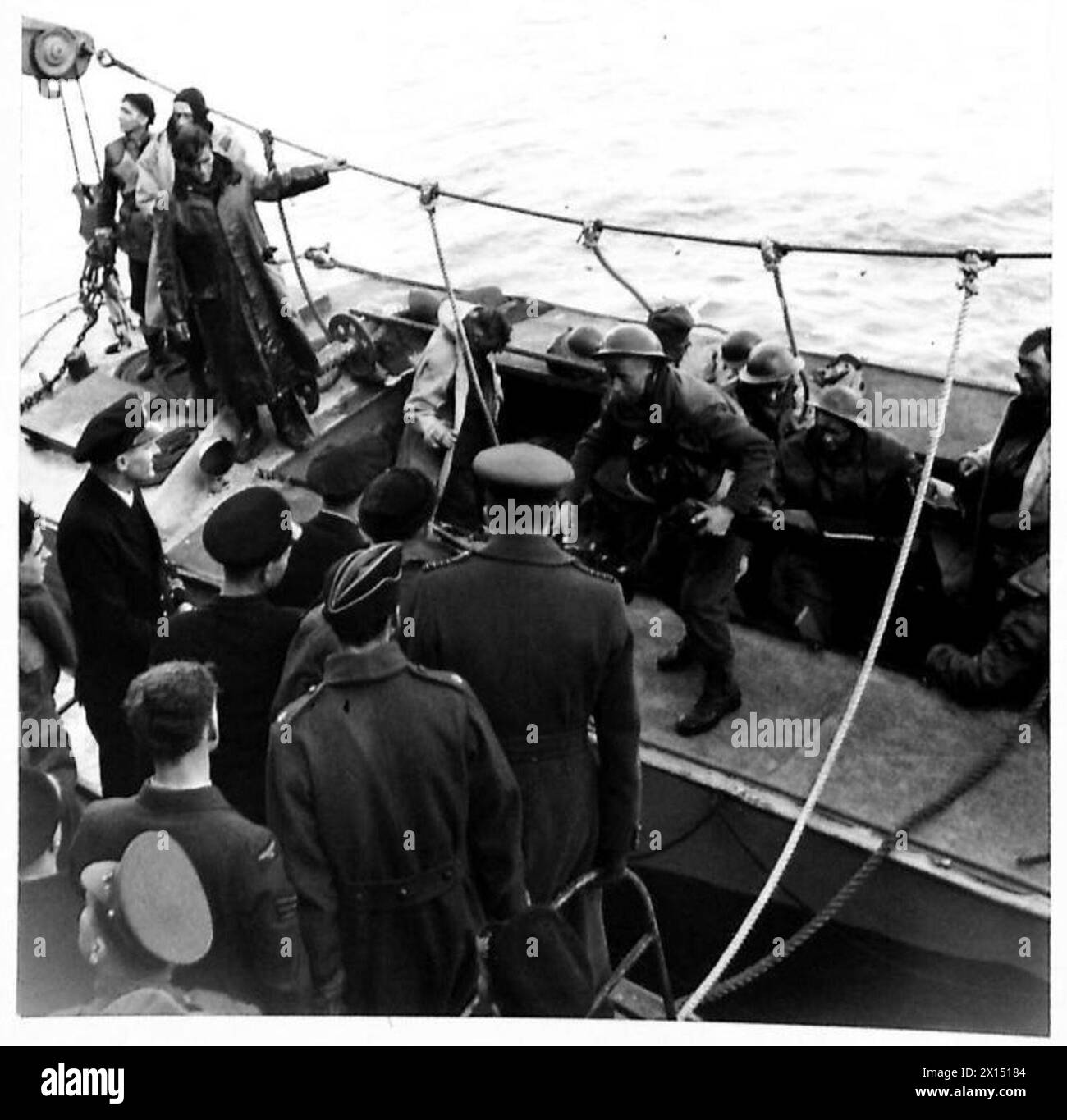 British paratroops and supporting infantry with blackened faces return ...