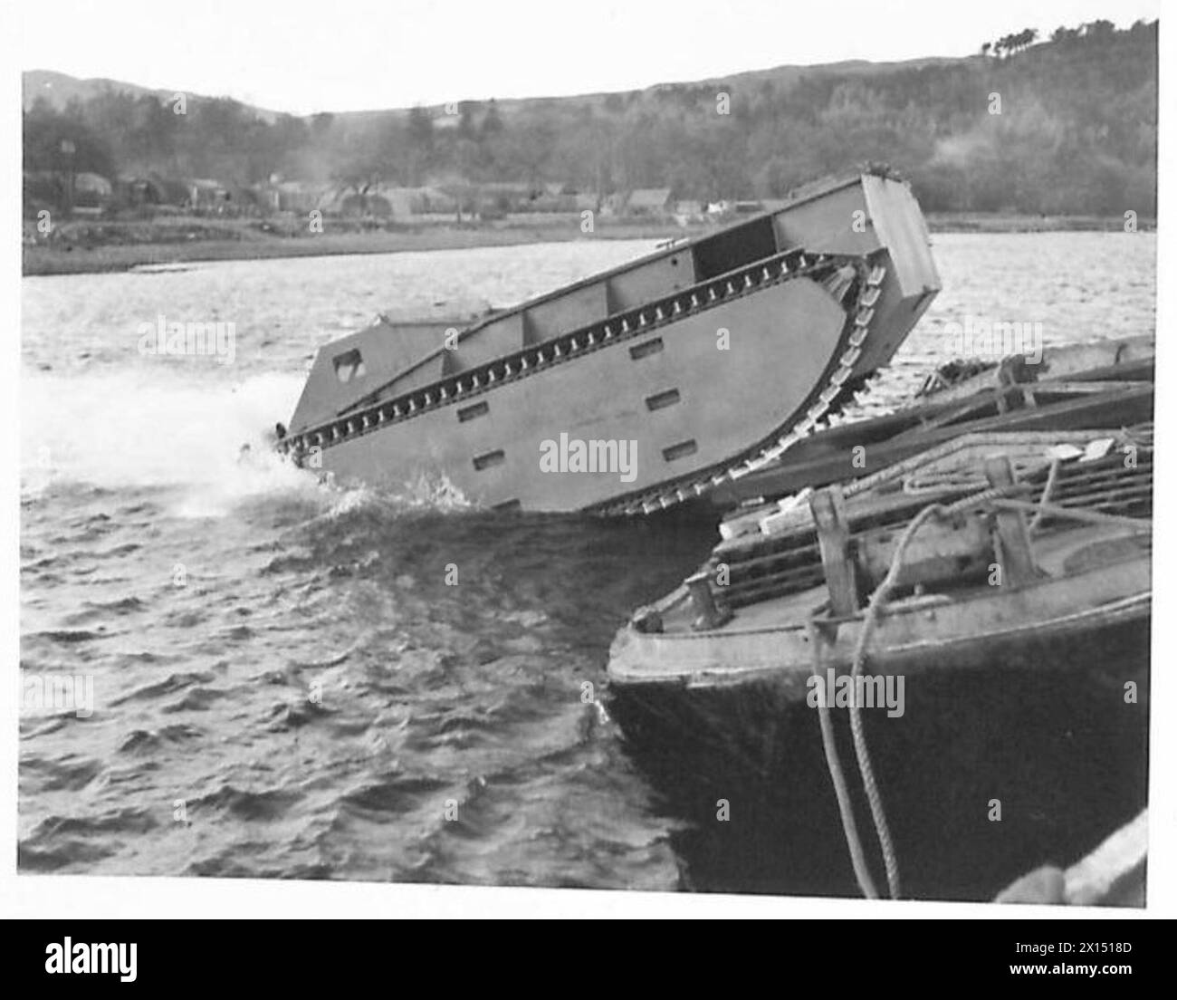An amphibious vehicle called the Alligator is launched into water ...