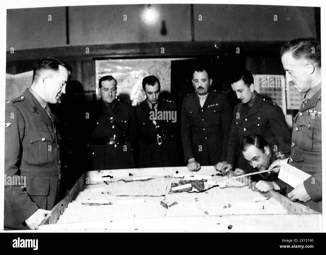 British Army officers conduct a discussion on tactics following a ...