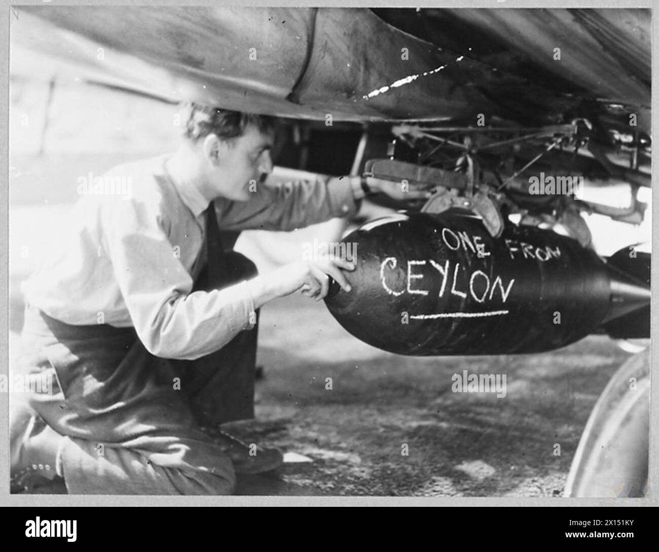 In 1944 Corporal Francis of Cardiff is shown loading ammunition marked ...