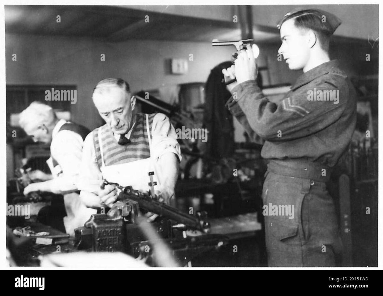SOLDIERS AND CIVILIANS REPAIR ARMY EQUIPMENT - Army and civilian ...