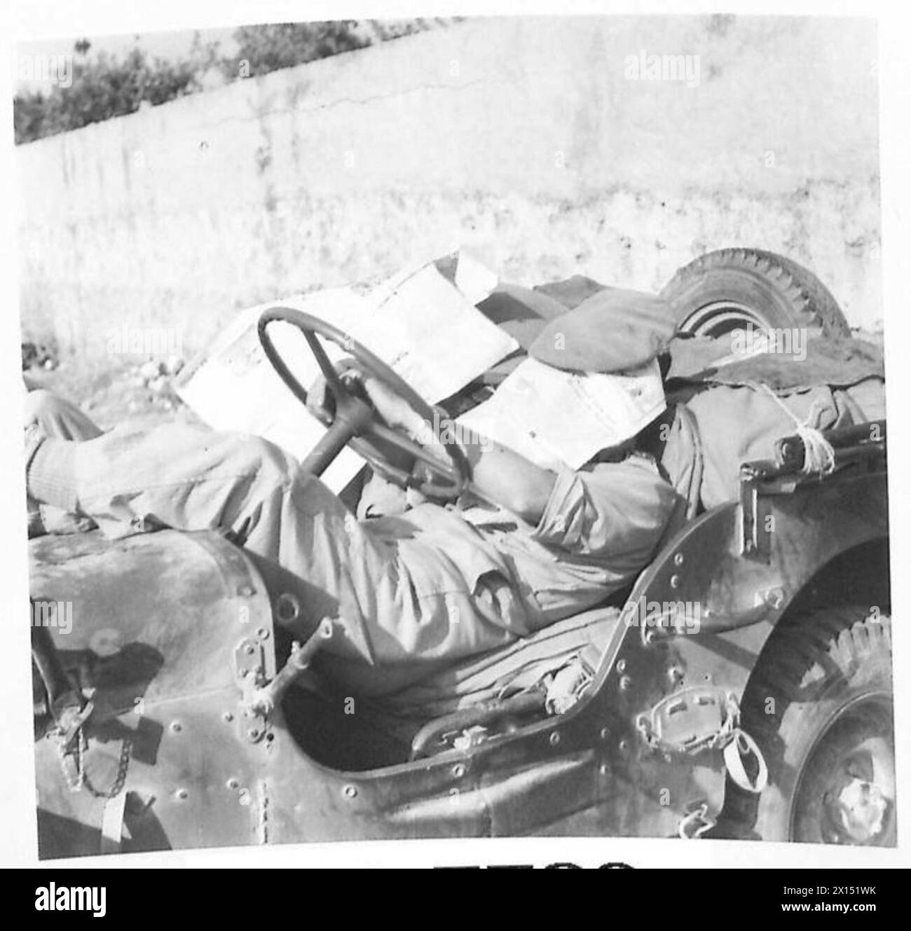 ITALY : EIGHTH ARMY FRONT - After dinner nap! Two British soldiers ...