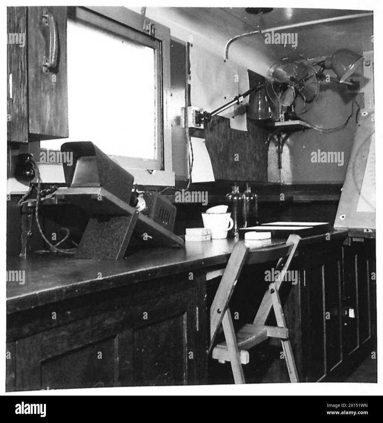 The interior of an anti-aircraft recording van at Harrow is shown ...