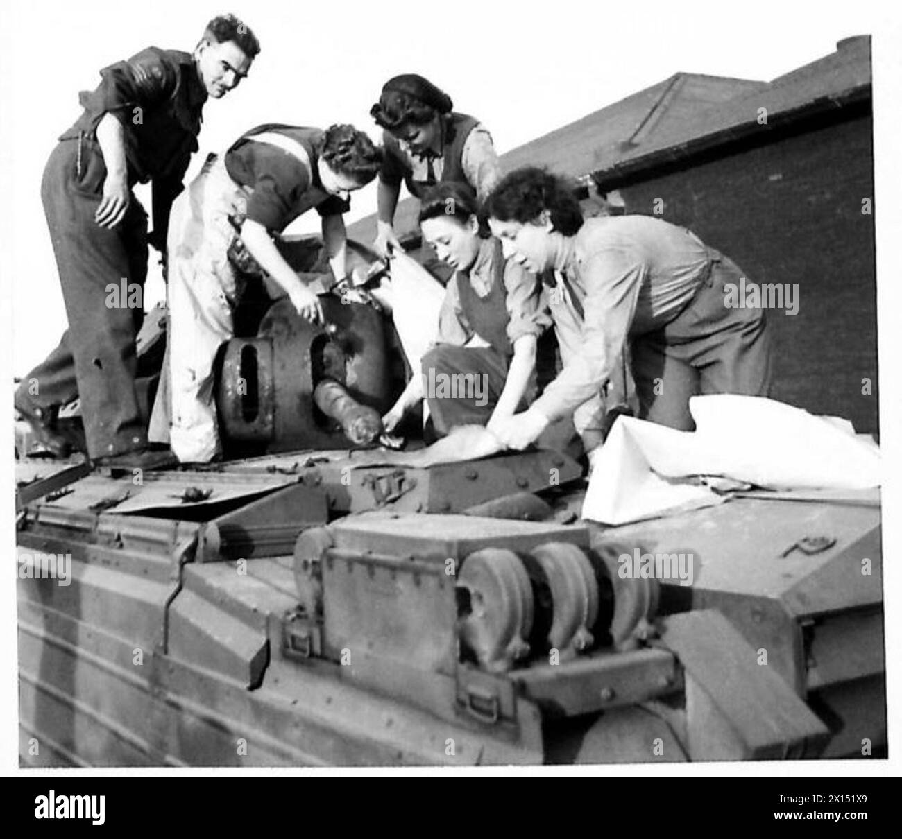 ATS CONVOY DRIVERS AND STORESWOMEN AT WORKS - An Army Sergeant watching ...