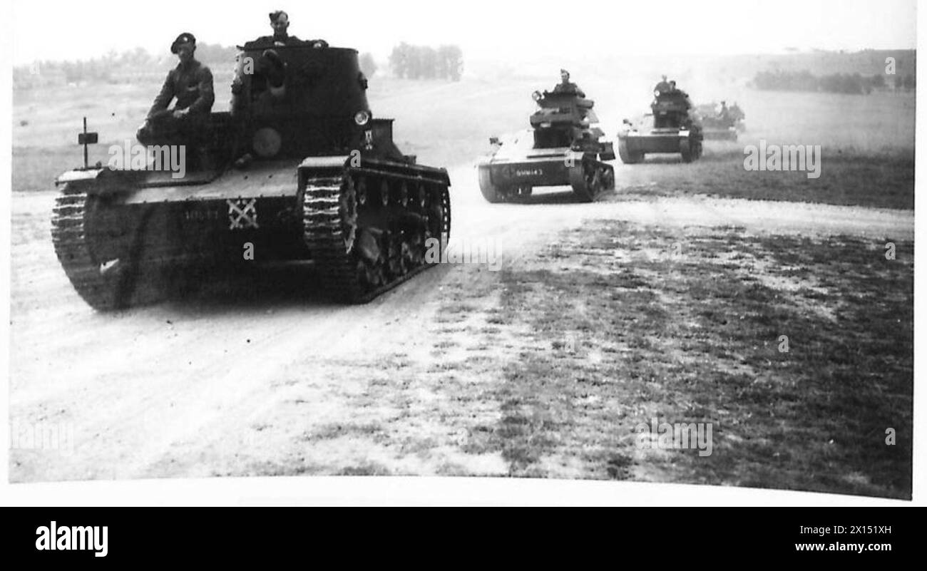 ONE OF BRITAIN'S STRIKING FORCES - Tanks moving across the country side ...