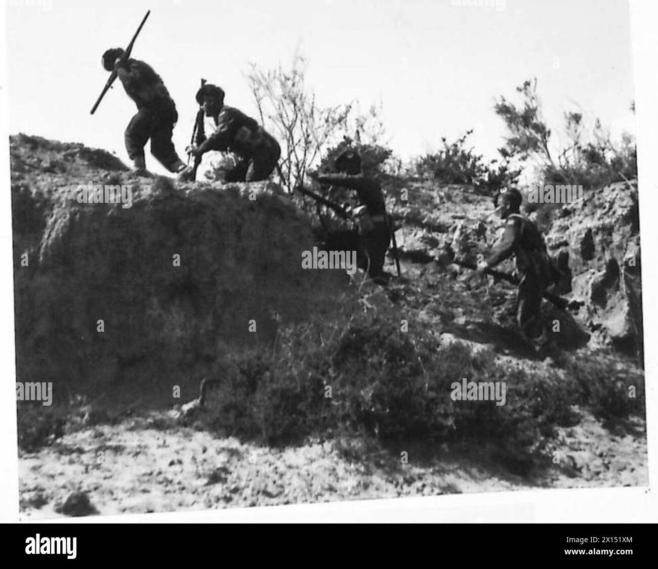 Gordon Highlanders of the British Army climb the opposite bank of the ...