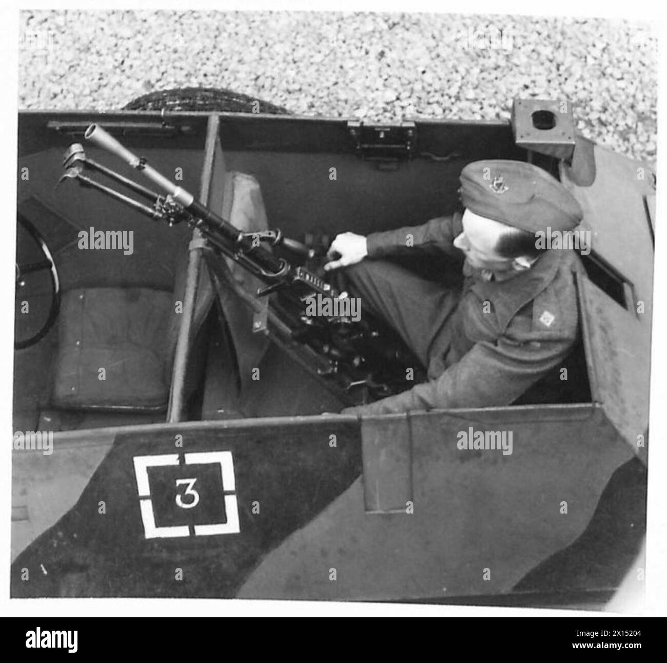Machine gun mountings for Bren guns are displayed on an armoured car in ...