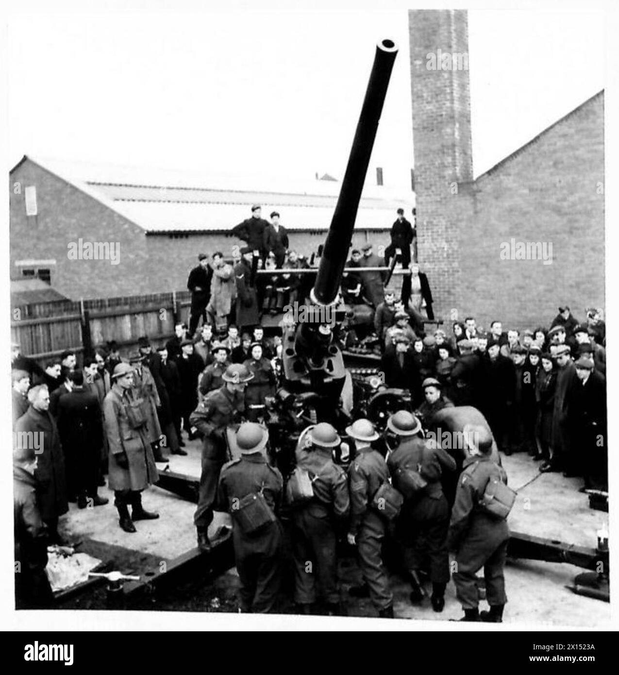 FACTORY WORKERS SEE THE FINISHED ARTICLE - Watching a 3.7 A.A. gun ...