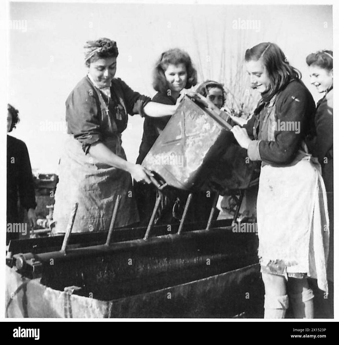 EIGHTH ARMY : LIFE BLOOD OF AN ARMY - Italian women washing petrol cans ...