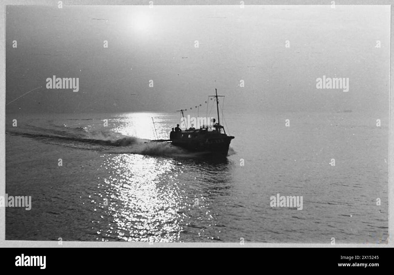 BARRAGE BALLOON TAKES TO THE WATER : - 8662. An R.A.F. seaplane tender ...