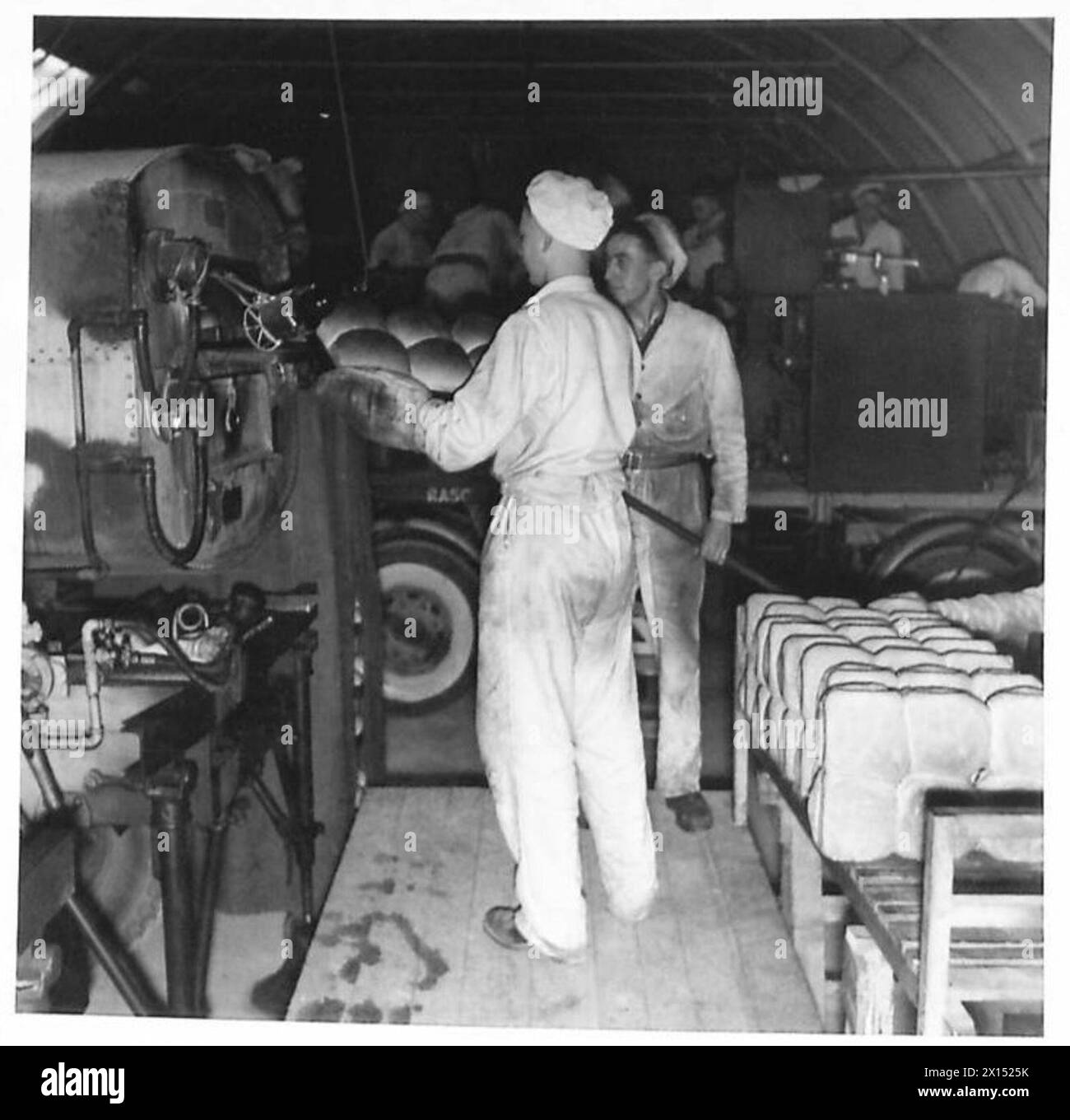MOBILE FIELD BAKERY - Freshly baked loaves being drawn from the ...