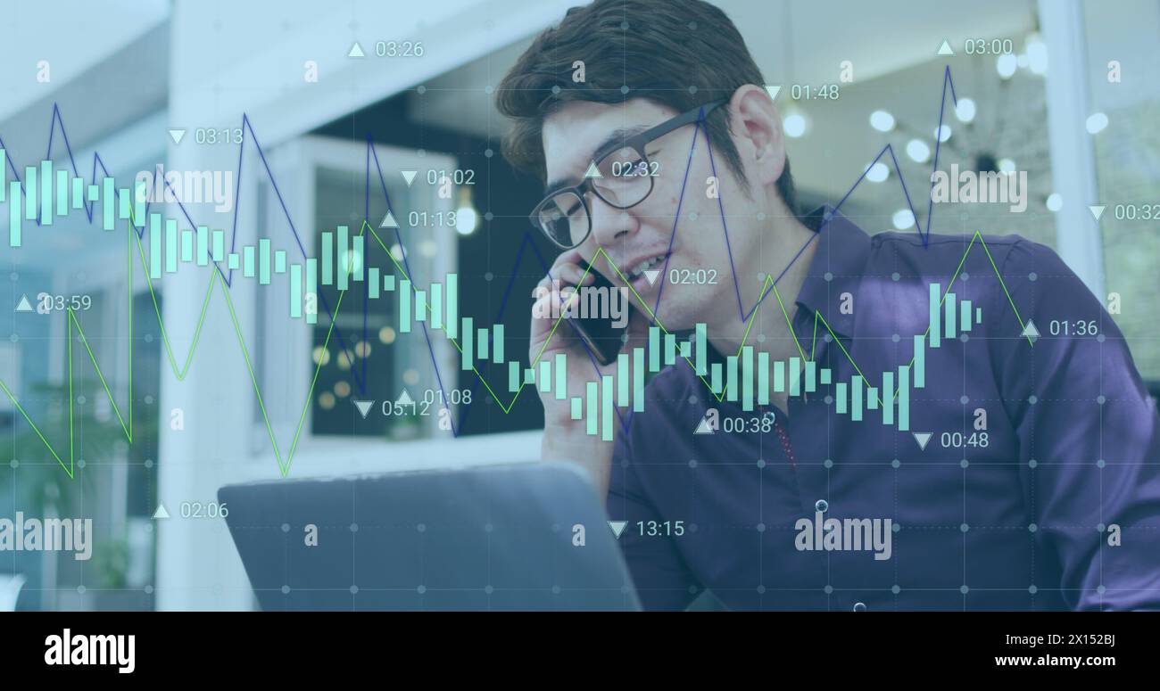 Image of graphs with changing numbers, asian man working on laptop and ...