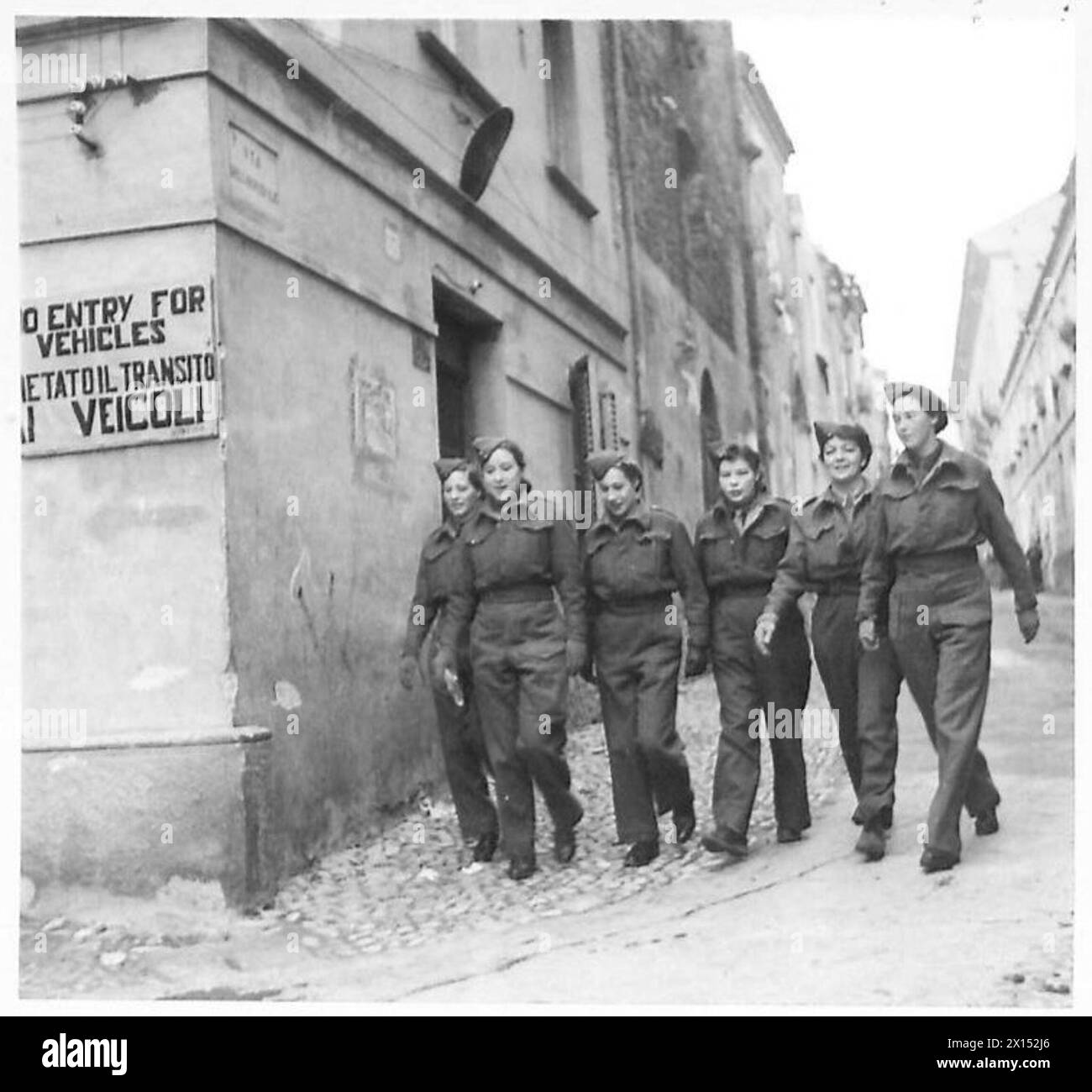 Front line nurses of the Eighth Army walk from their billet along Via ...