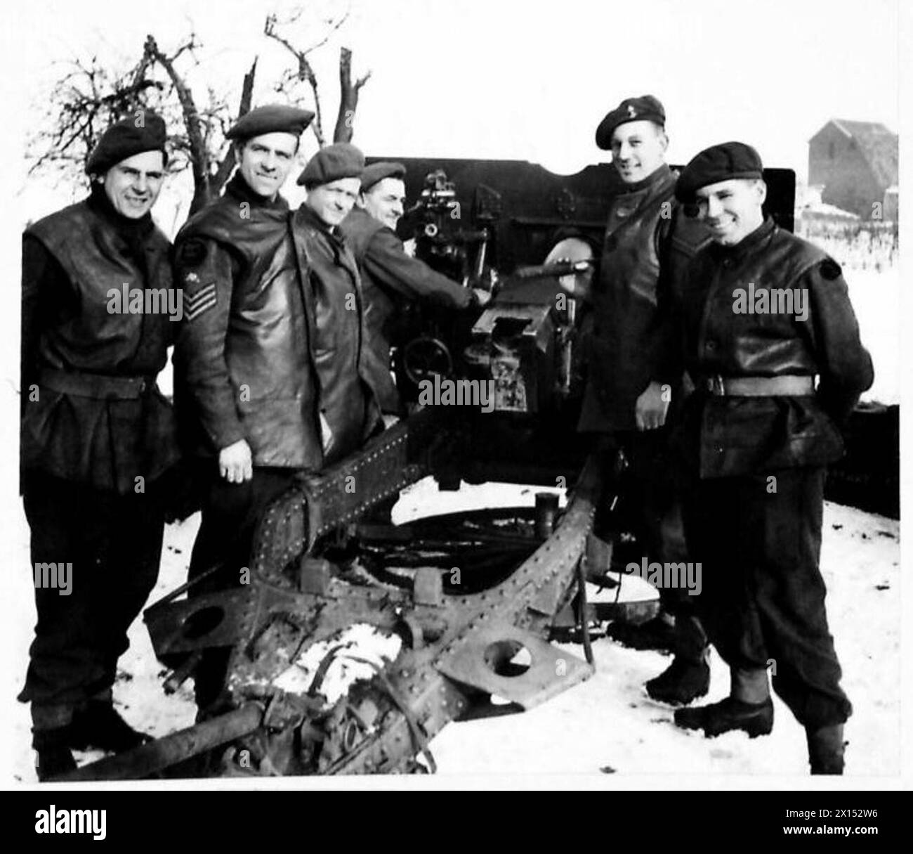 Members of the 'Geordies' unit are stationed by their 25-pounder gun ...