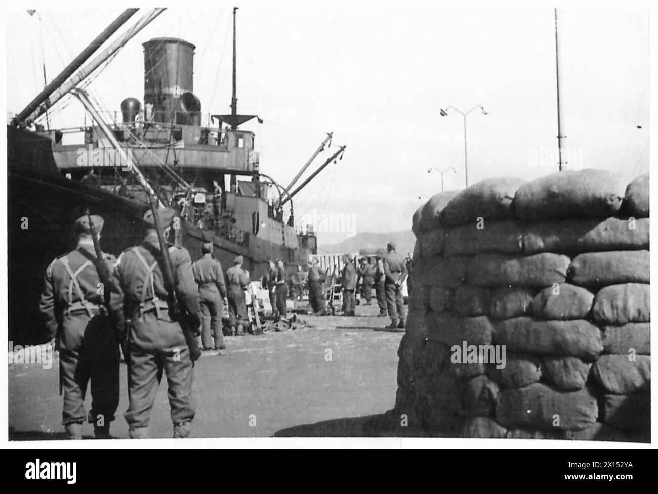 BRITISH AND CANADIAN TROOPS IN ICELAND - A.M.P.C. unloading ships at ...
