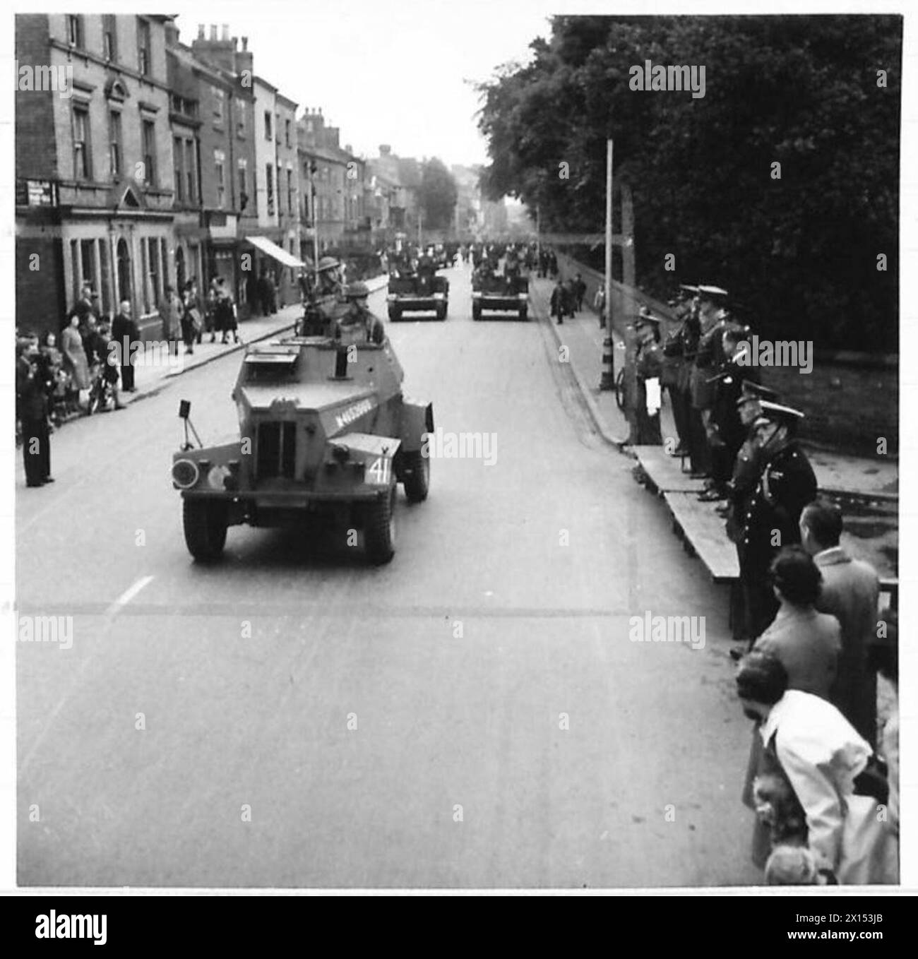 MILITARY DISPLAY FOR WORKERS - Troops and vehicles pass the saluting ...
