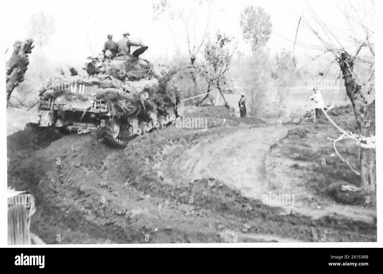 Infantry cross the River Rabbi supported by tanks of the 2nd Armoured ...