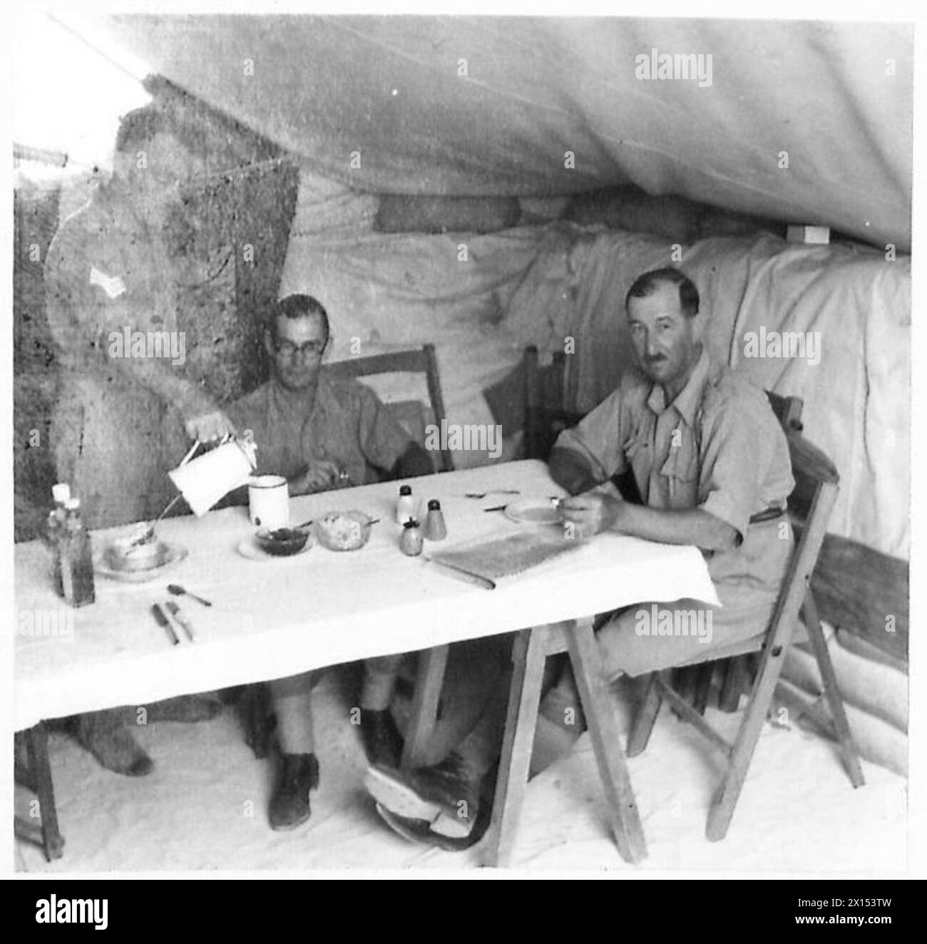 The interior of an officers' mess dug out of sand for the 1st Battalion ...