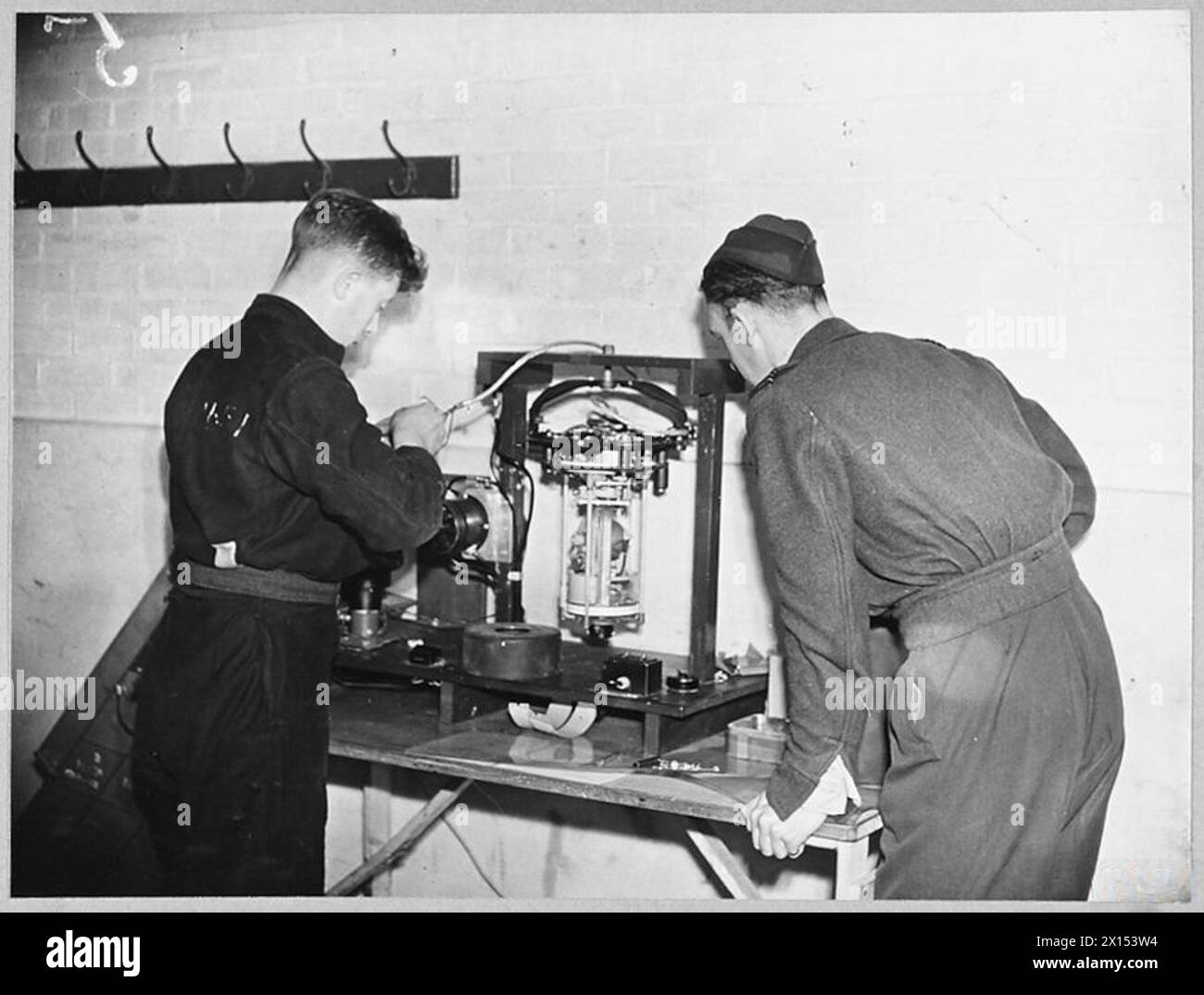 BOMBER CREWS (Picture issued 1942) - 6868 The Navigation officer [right ...