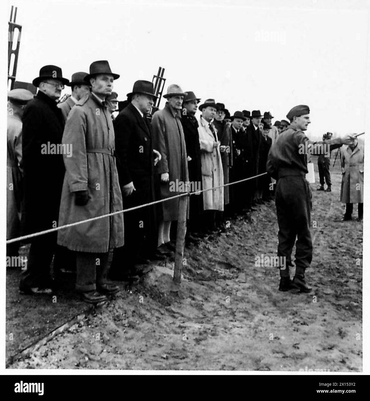 MEMBERS OF PARLIAMENT SEE A.A. DEFENCES - Major Simpson giving the MPs ...