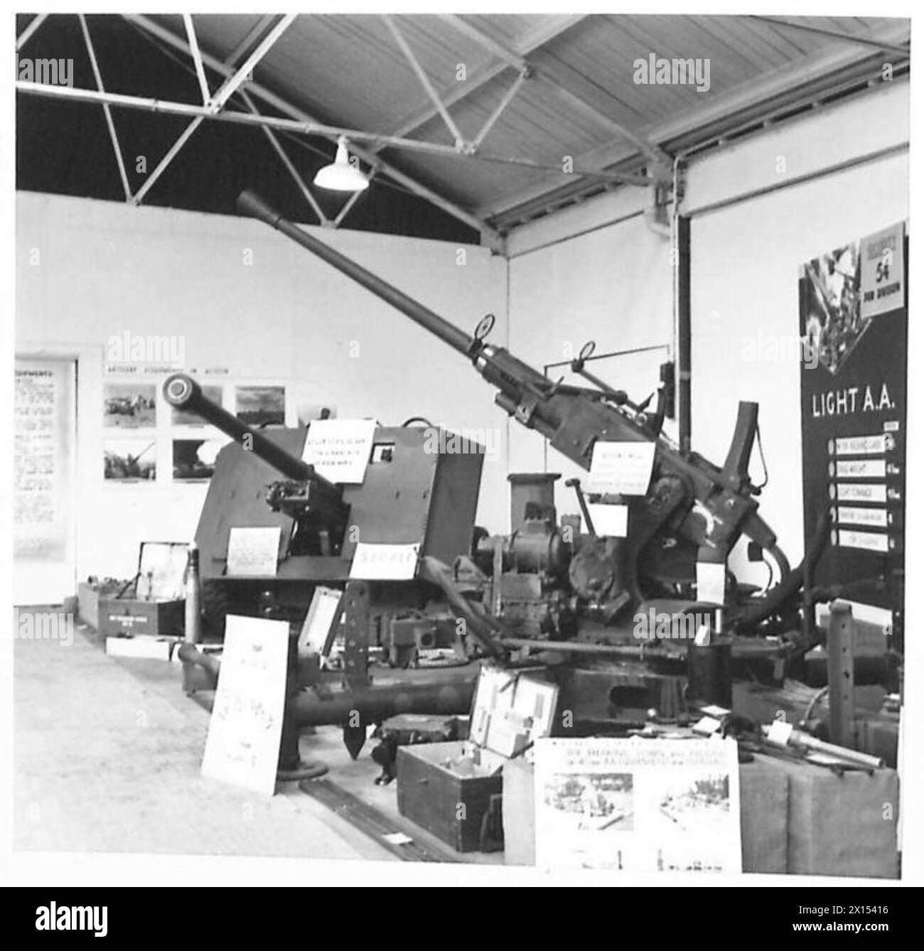 EQUIPMENT EXHIBITION AT ROYAL ORDNANCE DEPOT - A 40 mm Bofors gun and ...