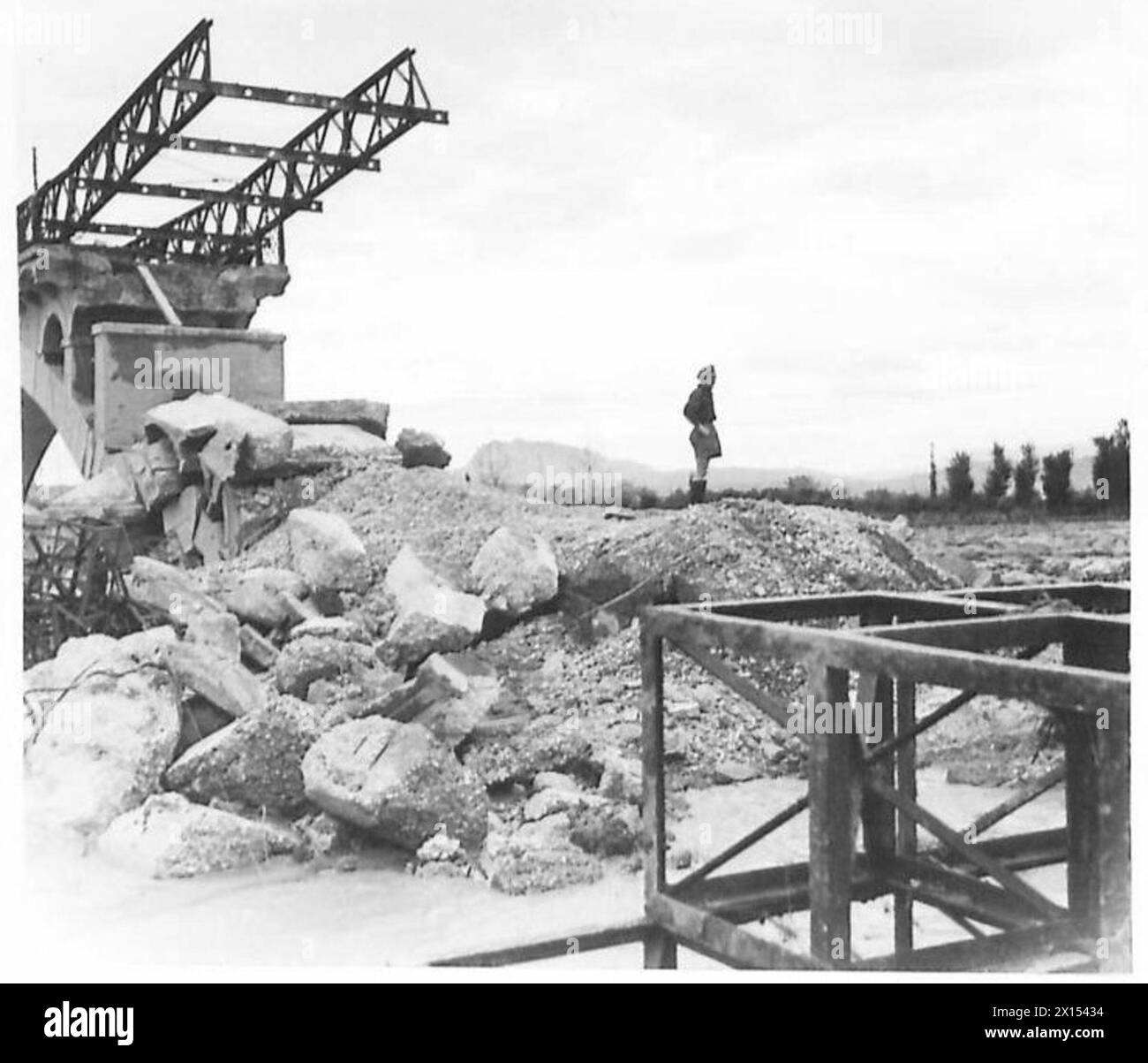 Bailey bridge sections are being installed over a broken arch of the ...
