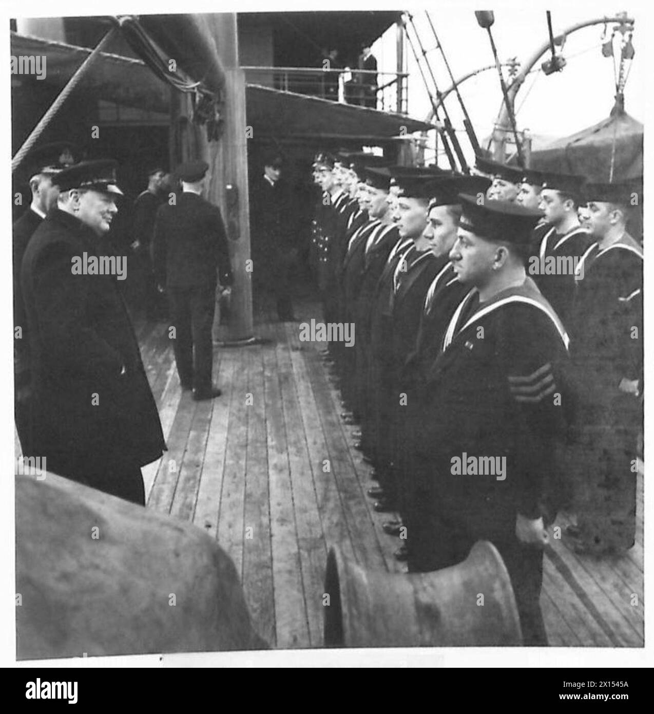 Prime Minister Winston Churchill inspects submarine crews aboard a ship ...