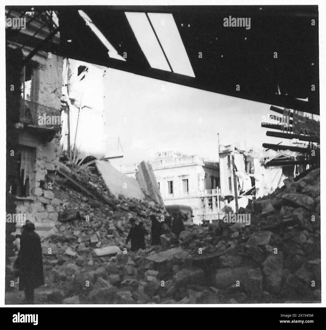 Civilians navigate rubble in Athens following the end of fighting ...