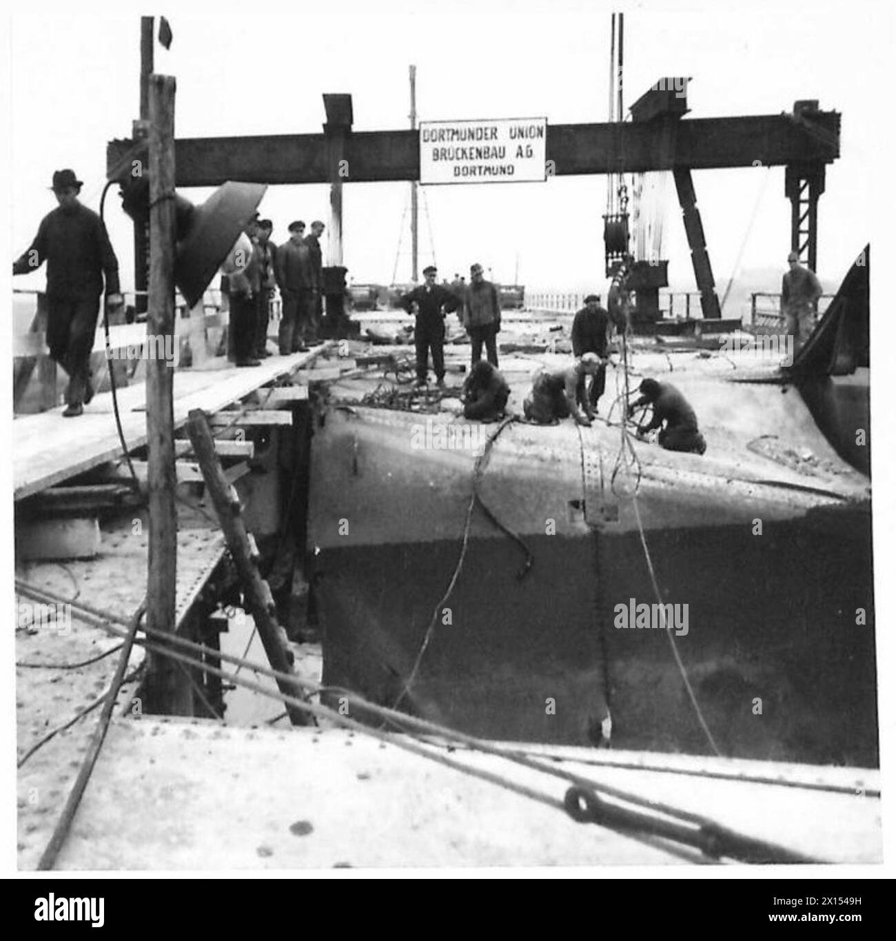 German forces repair blown bridges, using temporary footpaths to ...