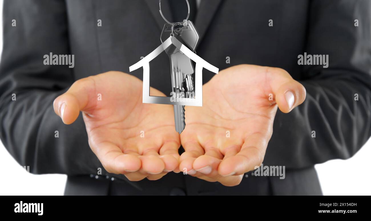 Image of silver house keys and house shaped key fob spinning over ...