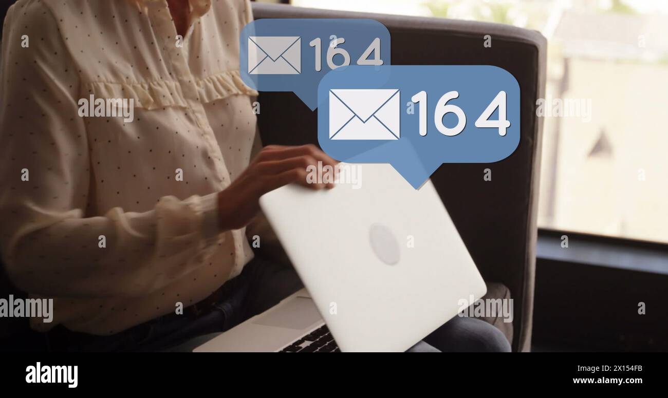 Image of icons and numbers over woman using laptop Stock Photo - Alamy