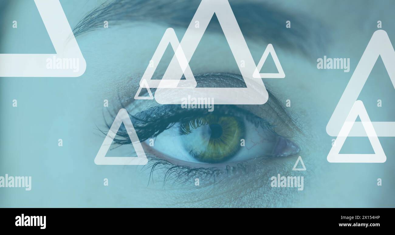 Image of white triangles flying up over woman's eye Stock Photo - Alamy