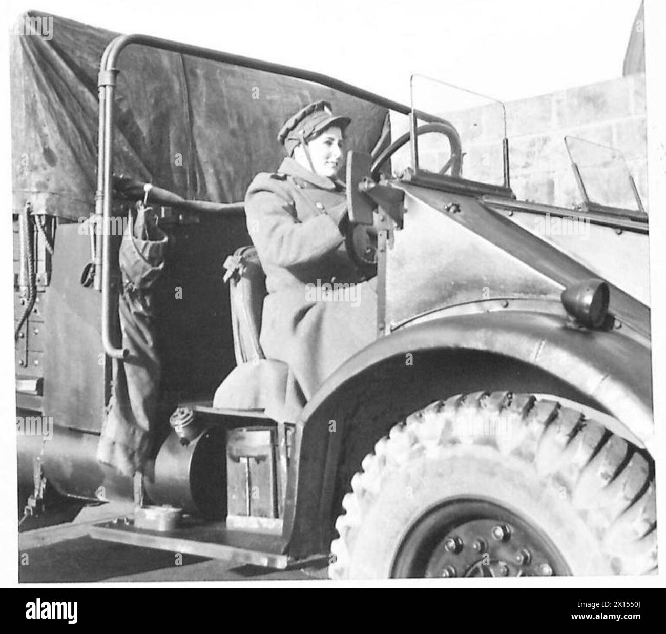 An ATS driver is shown at the wheel of a truck in an anti-aircraft ...