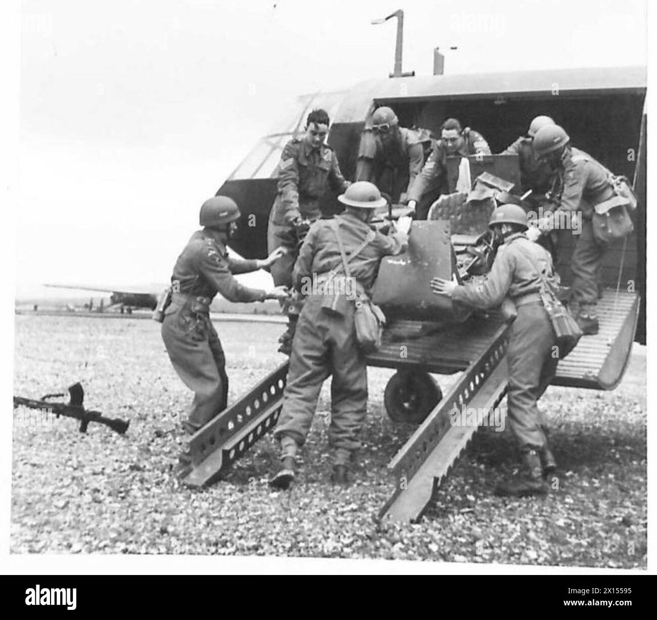 EQUIPMENT CARRIED BY GLIDERS - Glider troops unload motor cycles and ...