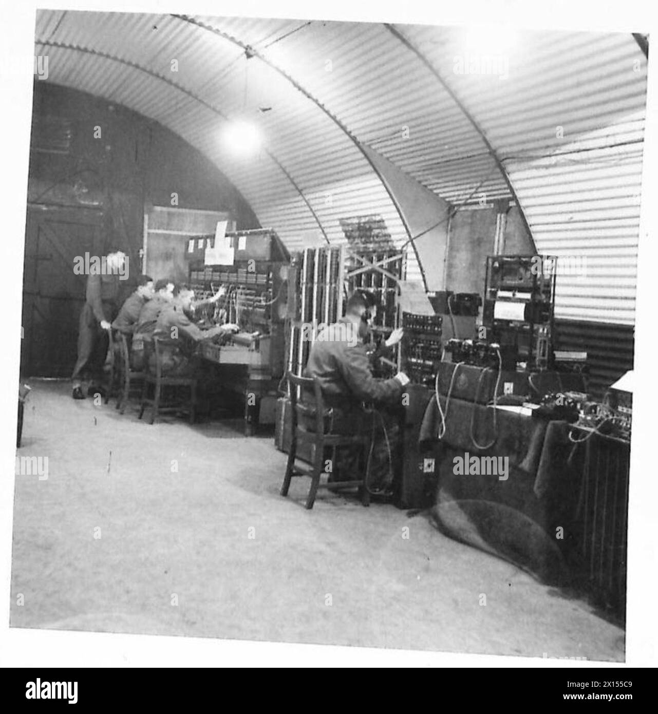 SIGNALS EXHIBITION - Operators working receiving and transmitting sets ...