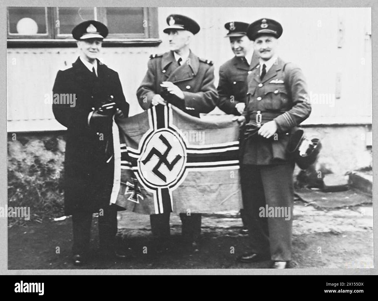 A U-Boat ensign was presented to the RAF by senior officers, including ...