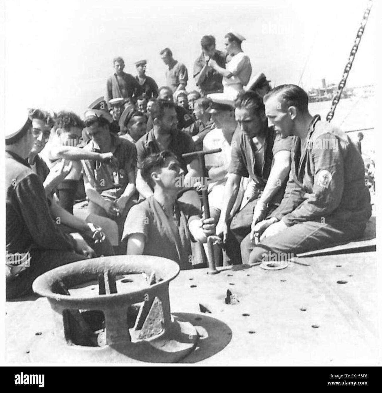 Crew members maintain the watch aboard a Royal Navy submarine as it ...