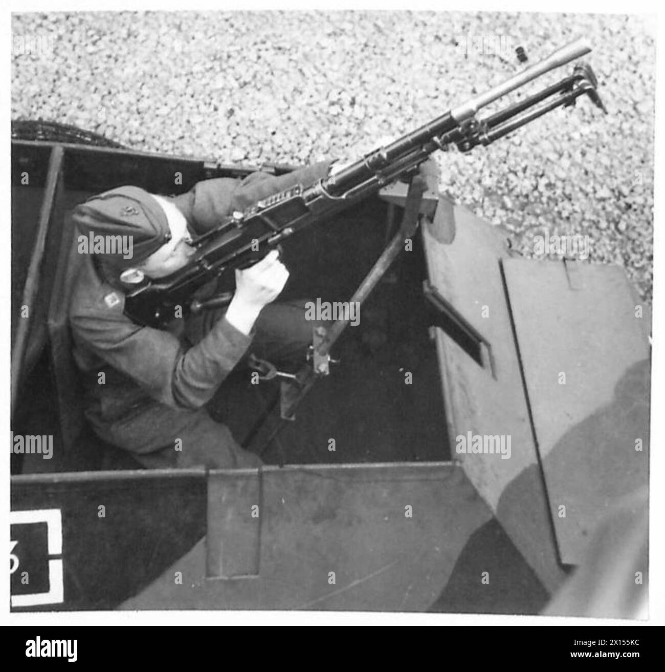 New Bren gun mountings are displayed on an armoured car and Beaverette ...