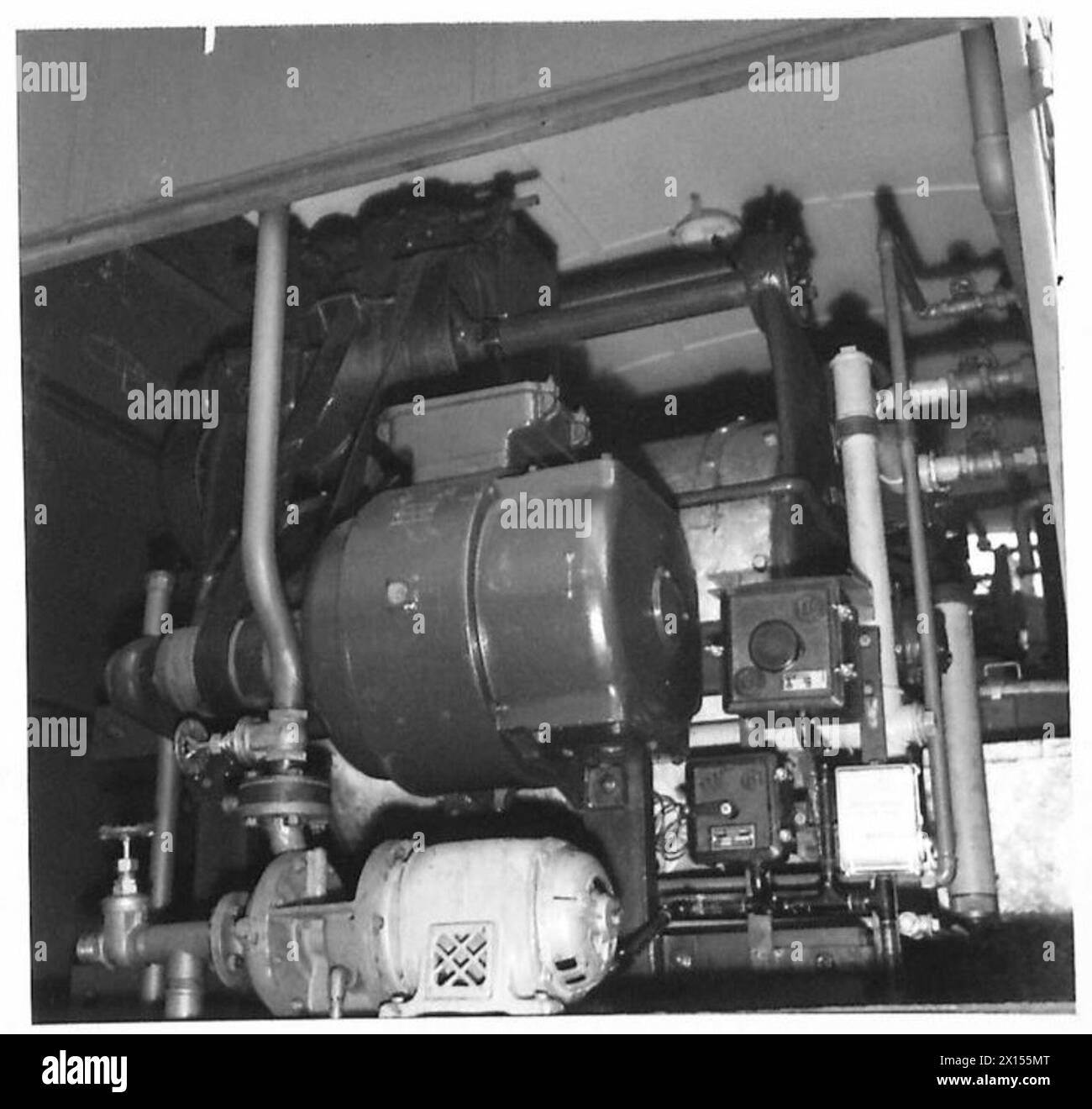 A general view of army washing machines with belt drive mechanisms is ...