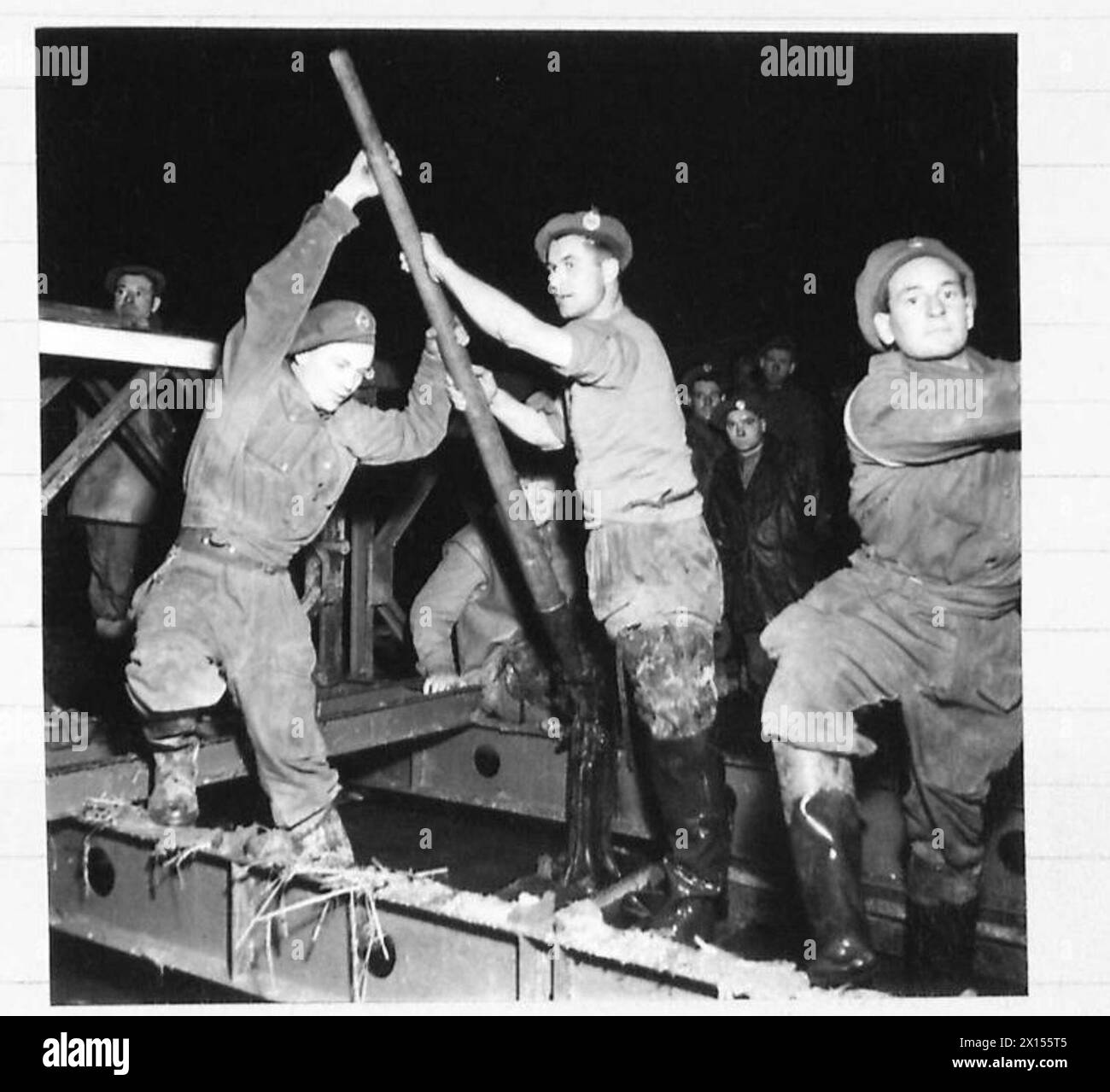 SAPPERS WORKING AT NIGHT ON BAILY BRIDGE - Working in rubber boots,the ...