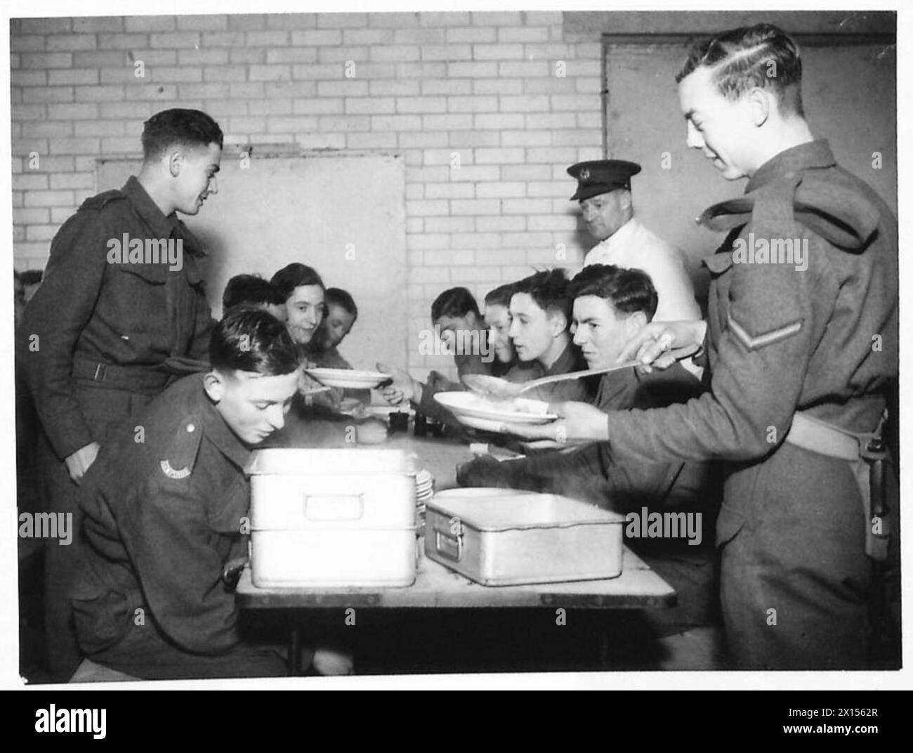 Members of a young soldier's battalion have a meal during British Army ...