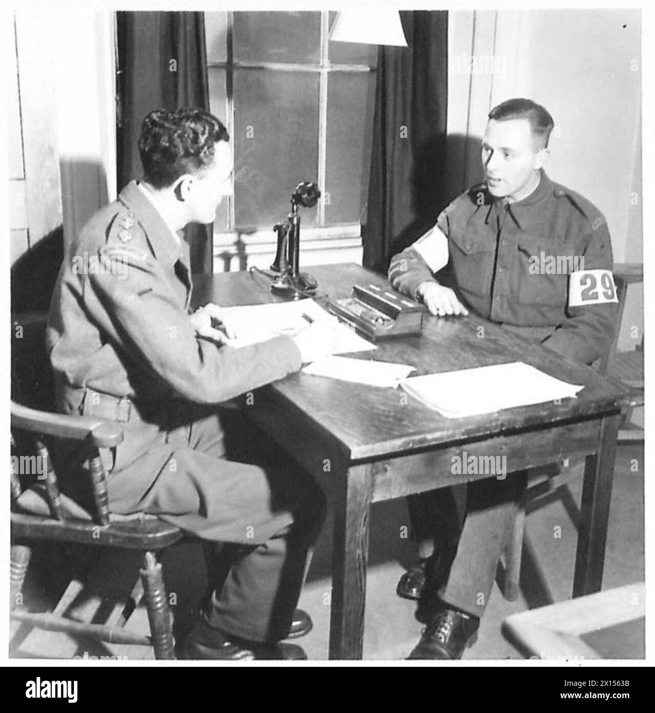 PERSONNEL SELECTION INTERVIEW - Personnel being interviewed by officers ...