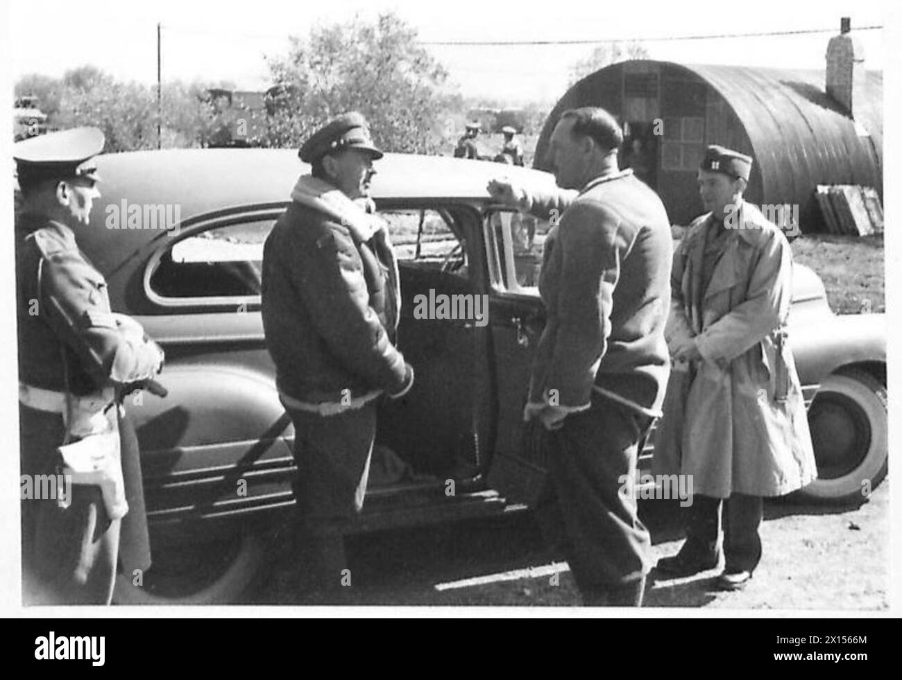 General Alexander and General Leese confer briefly before General ...