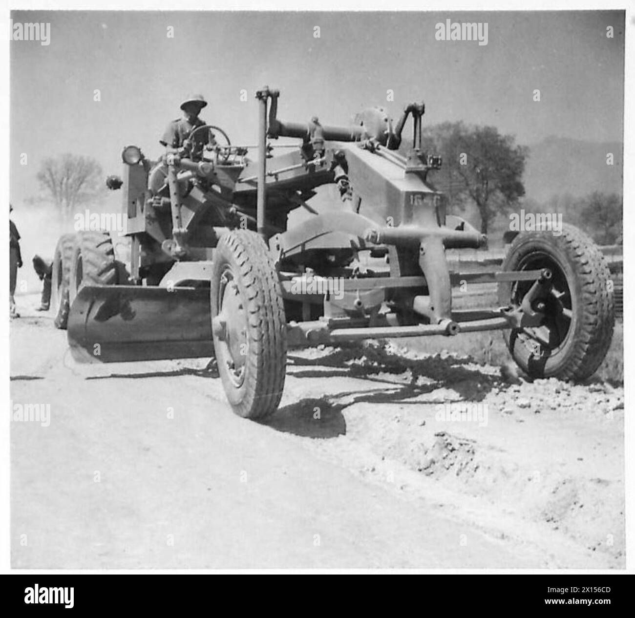 FIFTH ARMY : ROAD REPAIRS - A motor grader takes up the work and ...