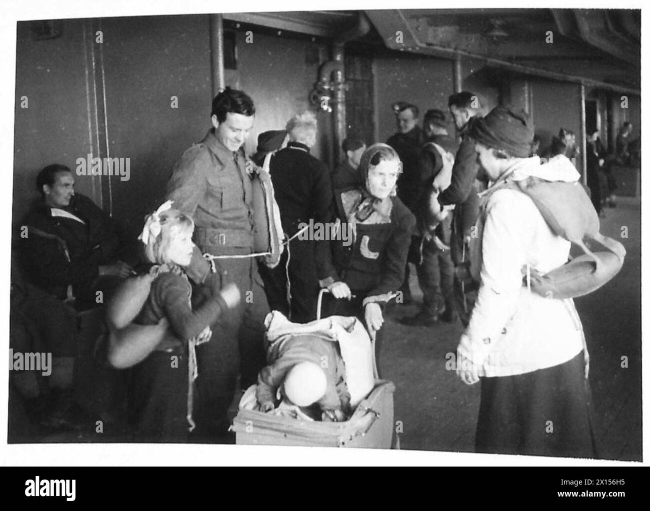 British Army soldiers and Norwegian civilians return homeward on a ship ...