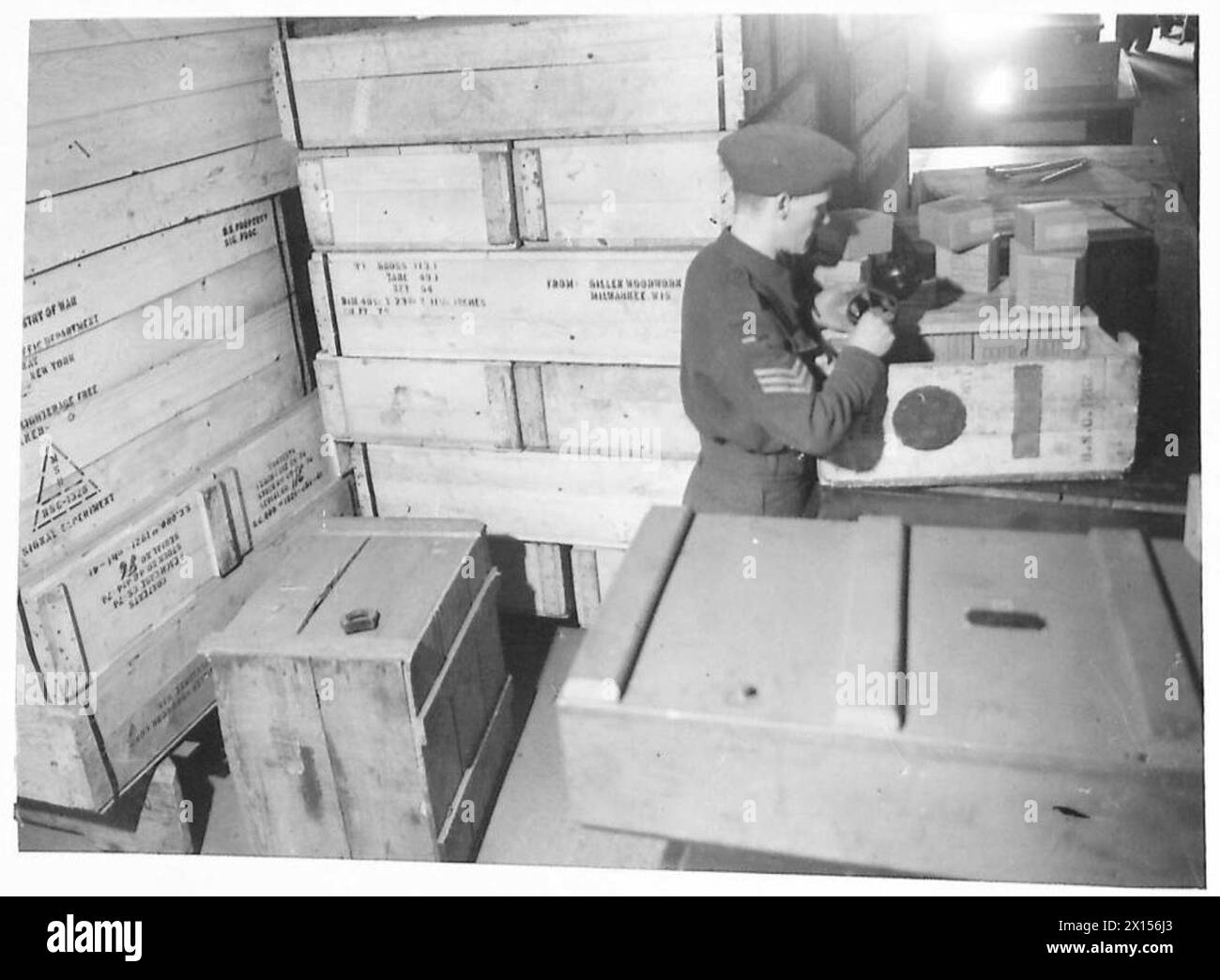 British Army personnel unpack and load telephone coils and C.114 ...