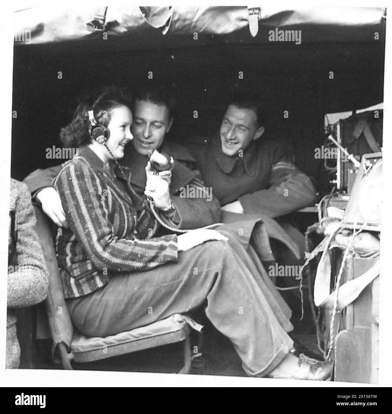 ARMY VISIT WIRELESS FACTORY WORKERS - One of the workers seated in a ...