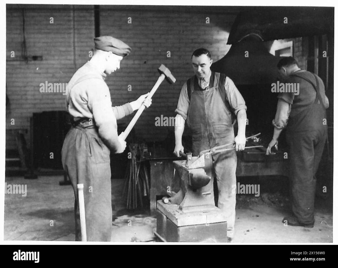 SOLDIERS AND CIVILIANS REPAIR ARMY EQUIPMENT - Army and civilian ...