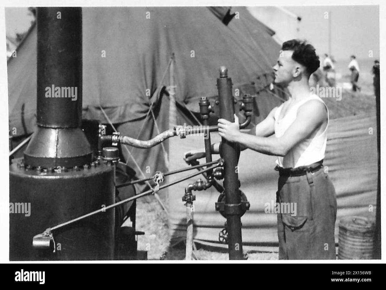 (8) CORPS REST CAMP - The man who pumps the hot water British Army ...