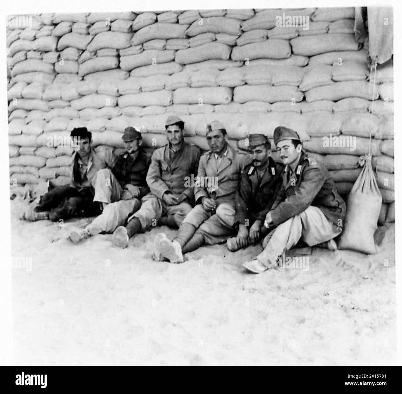 Italian prisoners await interrogation under British Army supervision ...